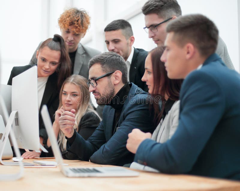 Team of Young Employees Looking Together at a Computer Screen. Stock ...