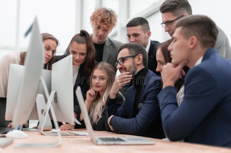 Team of Young Employees Looking Together at a Computer Screen. Stock ...