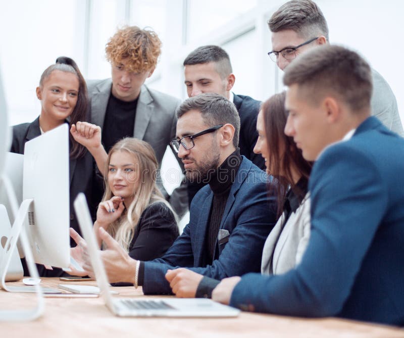 Team of Young Employees Looking Together at a Computer Screen. Stock ...