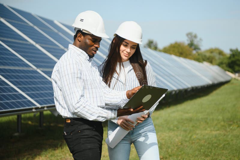 Team of Young Engineers on a Solar Farm Stock Photo - Image of male ...