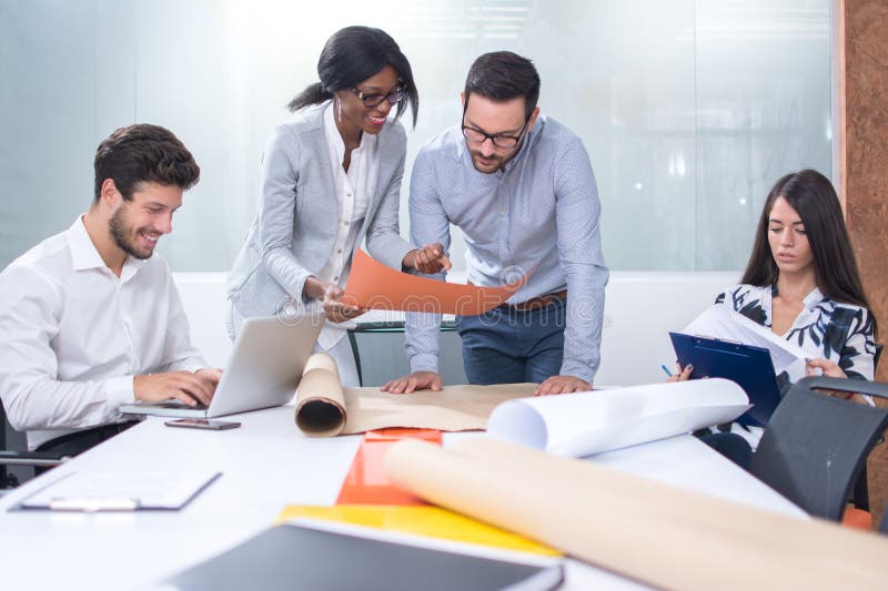 Team of Young Engineers Working on New Project in Office Stock Photo ...