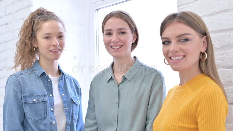 Team of Young Female Smiling at the Camera Stock Photo - Image of woman ...