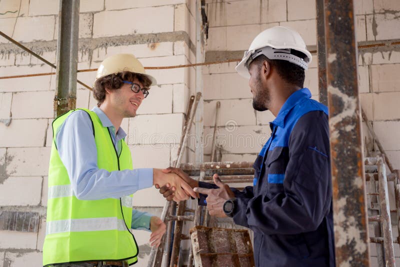Team of Young Foreman and Worker Handshake with Hands for Teamwork for ...