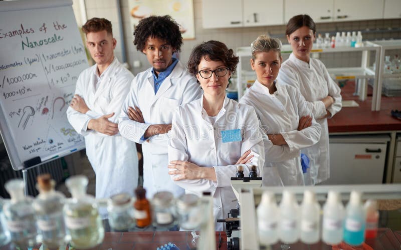Team of Young Laboratory Technicians Stock Photo - Image of ...