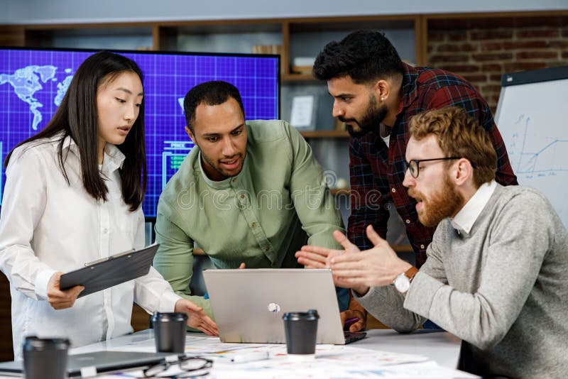 A Team of Young Multinational Business People are Working on a Startup ...