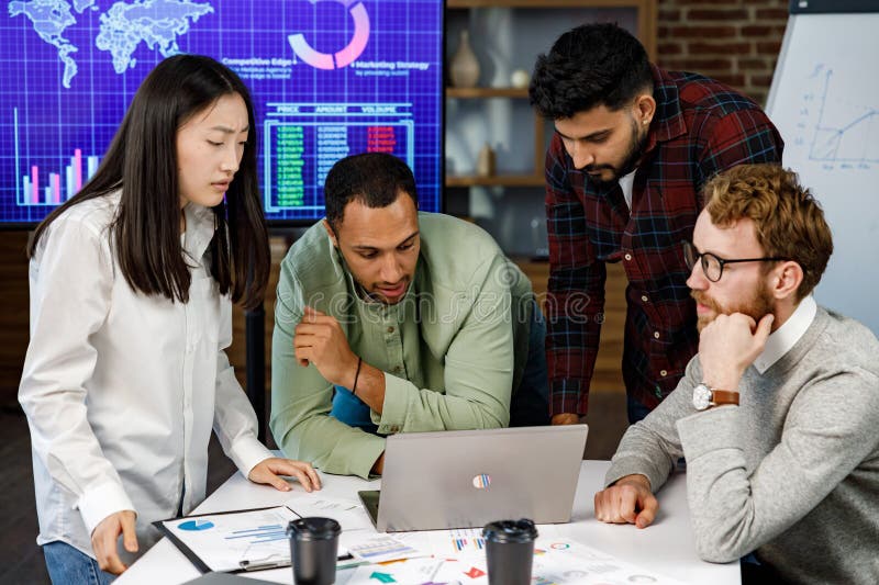 A Team of Young Multinational Business People are Working on a Startup ...