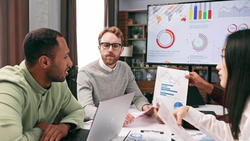 A Team of Young Multinational Business People are Working on a Startup ...