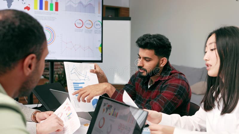 A Team of Young Multinational Business People are Working on a Startup ...