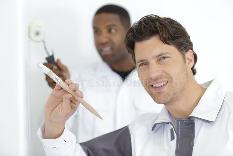 Team Young Painters during Finishing Interior Stock Photo - Image of ...