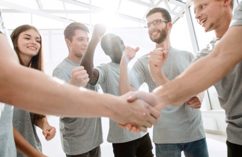 Team of Young Professionals Sitting at an Office Desk Stock Image ...