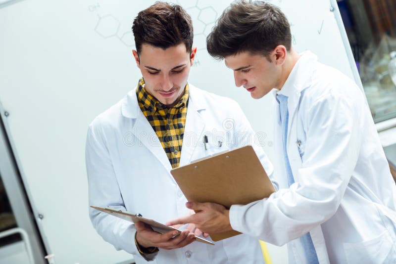 Team of Young Professional Scientists Working in Laboratory. Stock ...