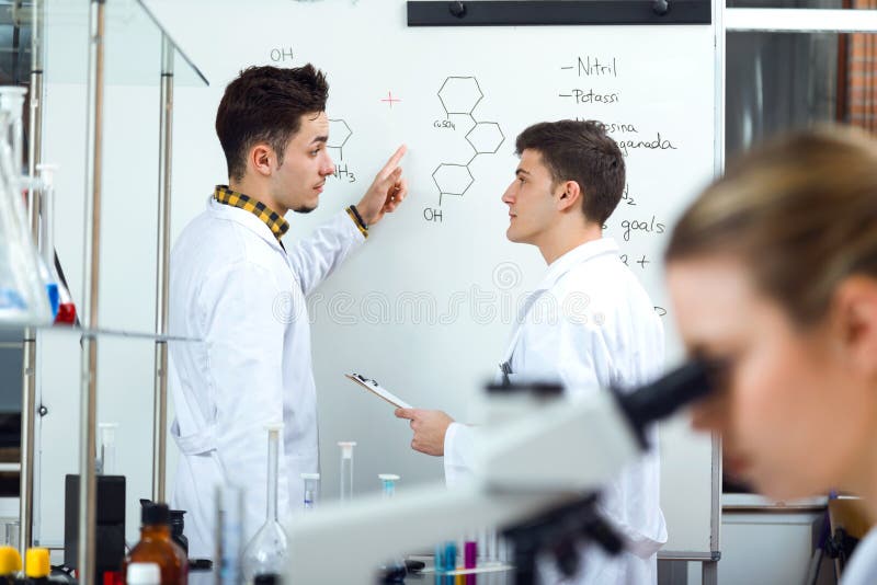 Team of Young Professional Scientists Working in Laboratory. Stock ...