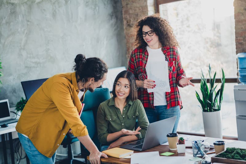 Young Colleagues Collaborating Actively in a Modern Office Setting ...