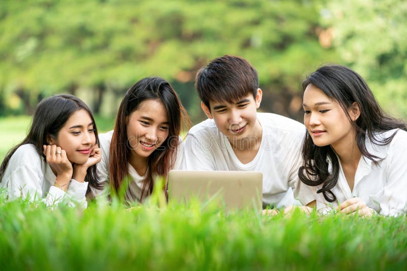 Team of Young Students Studying in the Park. Stock Image - Image of ...