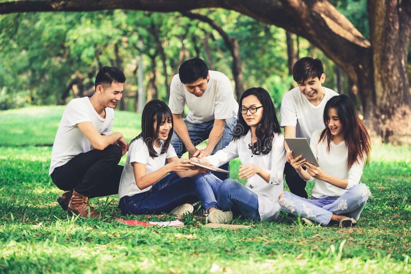 Team of Young Students Studying in the Park. Stock Image - Image of ...