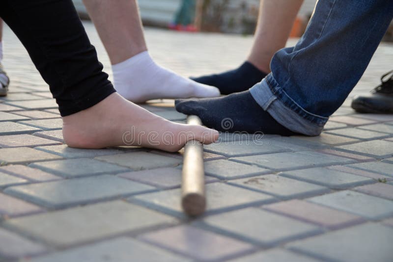 Teambuilding Activity with a Stick and Feet. Collective Support and ...