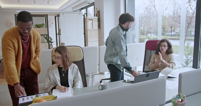 Teamwork in Action As Diverse Business Professionals Engage in Office ...