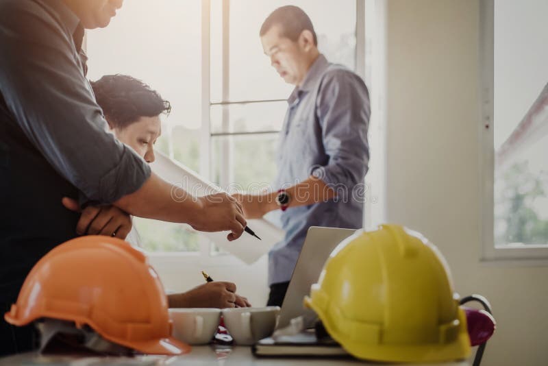 Architect or Engineer Team Working with Blueprints Building Plan Design ...