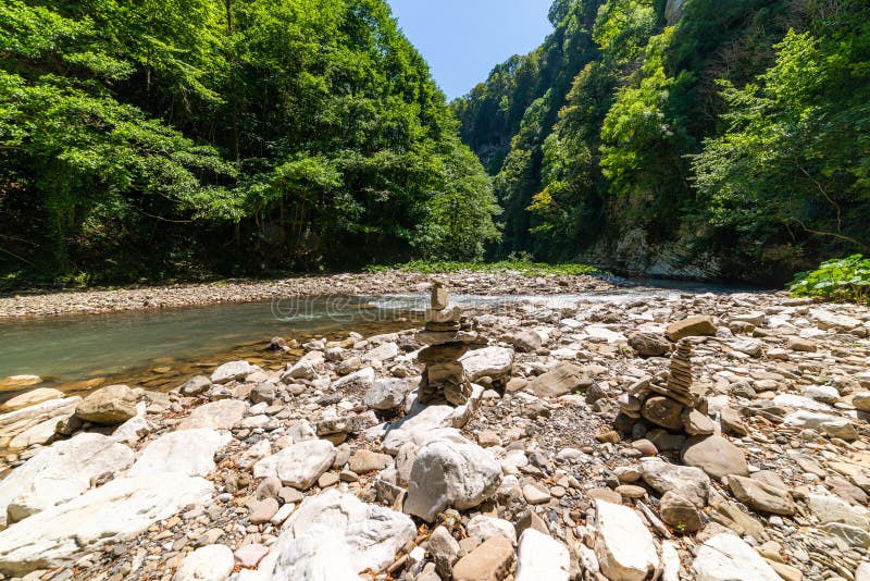 Teamwork Balance Concept. Balance Stone on River Coast Stock Photo ...