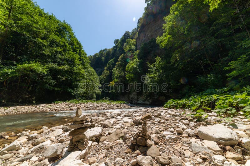 Teamwork Balance Concept. Balance Stone on River Coast Stock Image ...
