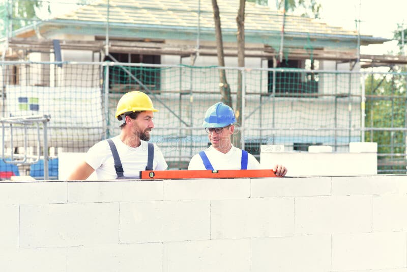 Teamwork on the Building Site - Construction Workers Build a Family ...