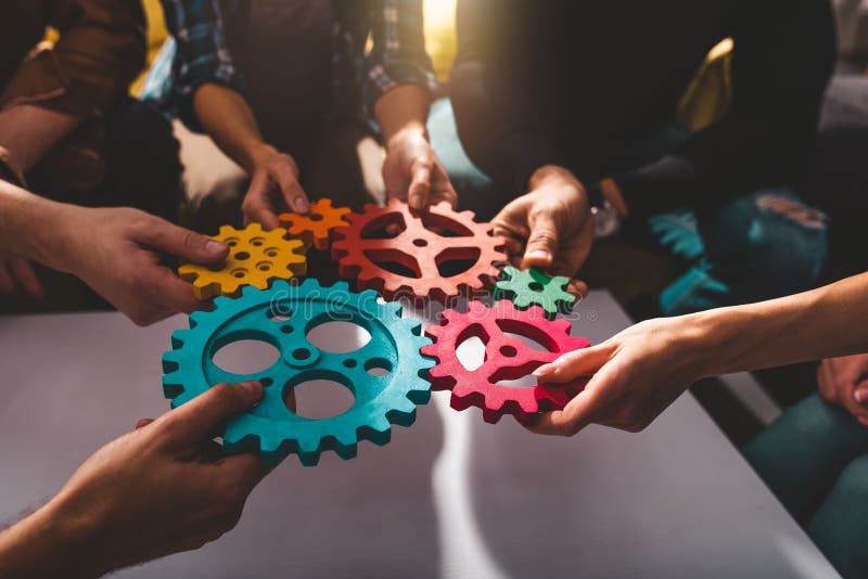 Teamwork of Business People Work Together and Combine Pieces of Gears ... Teamwork of Business People Work Together and Combine Pieces of Gears ...