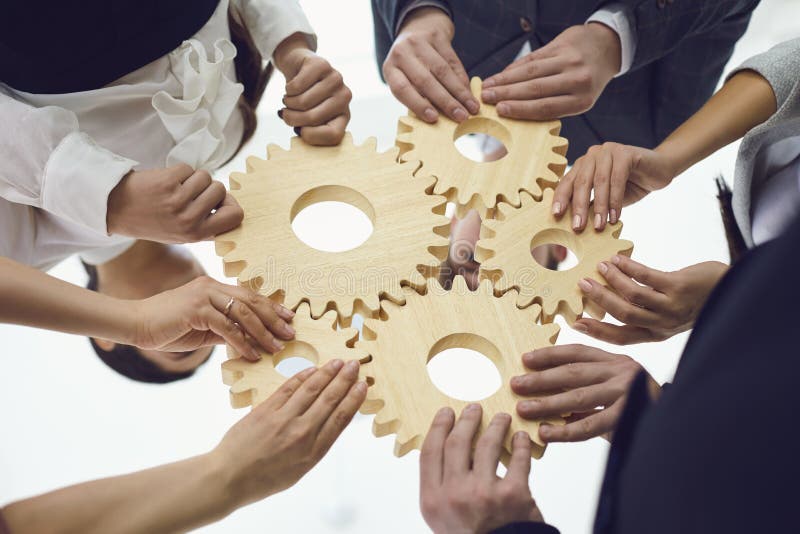 Teamwork Concept.Group of Businessmen with Gears at the Table at the ...