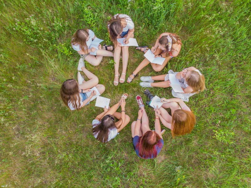 Teamwork Concept. a Group of Female Student Girls are Sitting on the ...