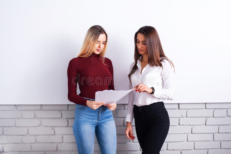 Teamwork Concept, Two Women Working on a Joint Project Stock Photo ...