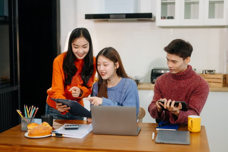 Teamwork and Creativity with Sitting Working at Kitchen Table Young ...