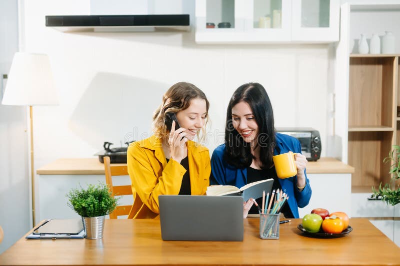 Teamwork and Creativity with Young Adults Collaborating on Laptops and ...