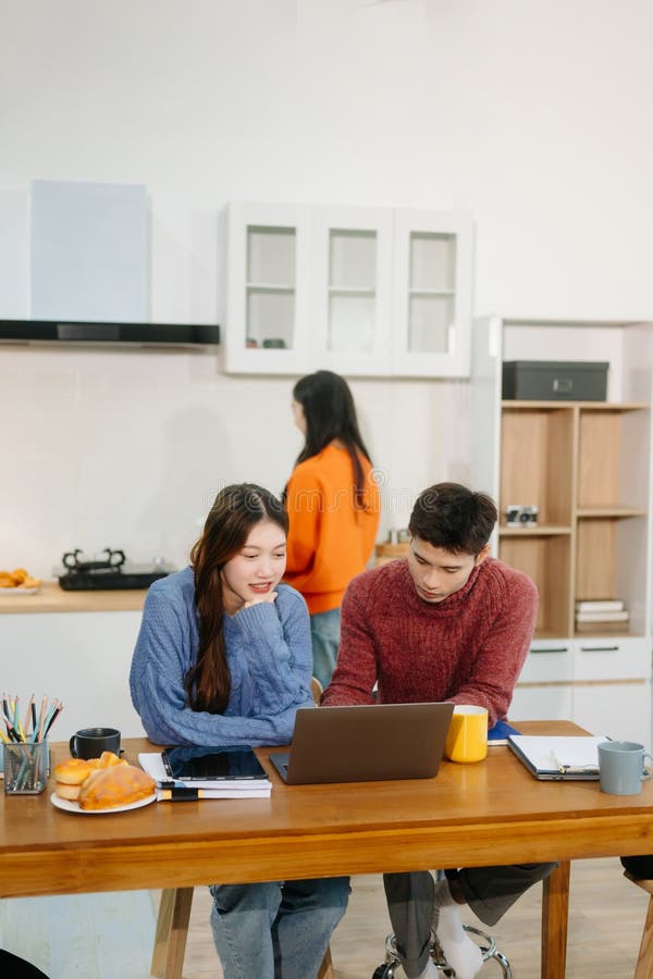 Teamwork and Creativity with Young Adults Collaborating on Laptops and ...