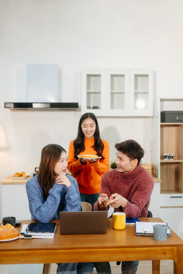 Teamwork and Creativity with Young Adults Collaborating on Laptops and ...