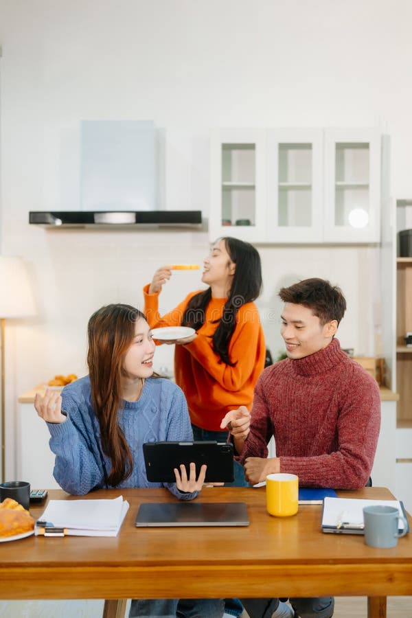 Teamwork and Creativity with Young Adults Collaborating on Laptops and ...