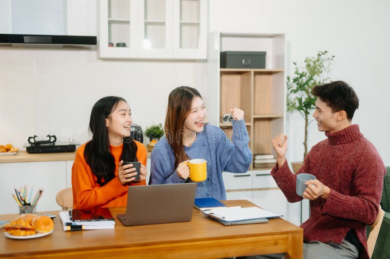 Teamwork and Creativity with Young Adults Collaborating on Laptops and ...