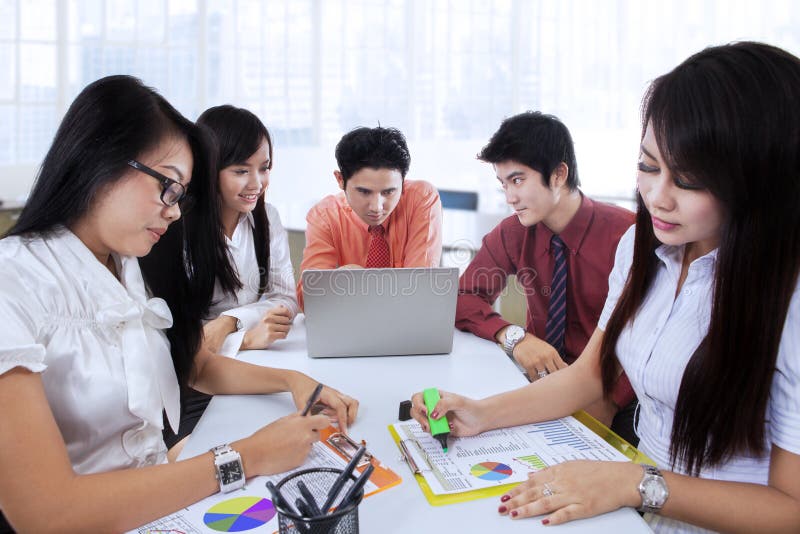Teamwork Discussing with Laptop on Desk Stock Photo - Image of chinese ...