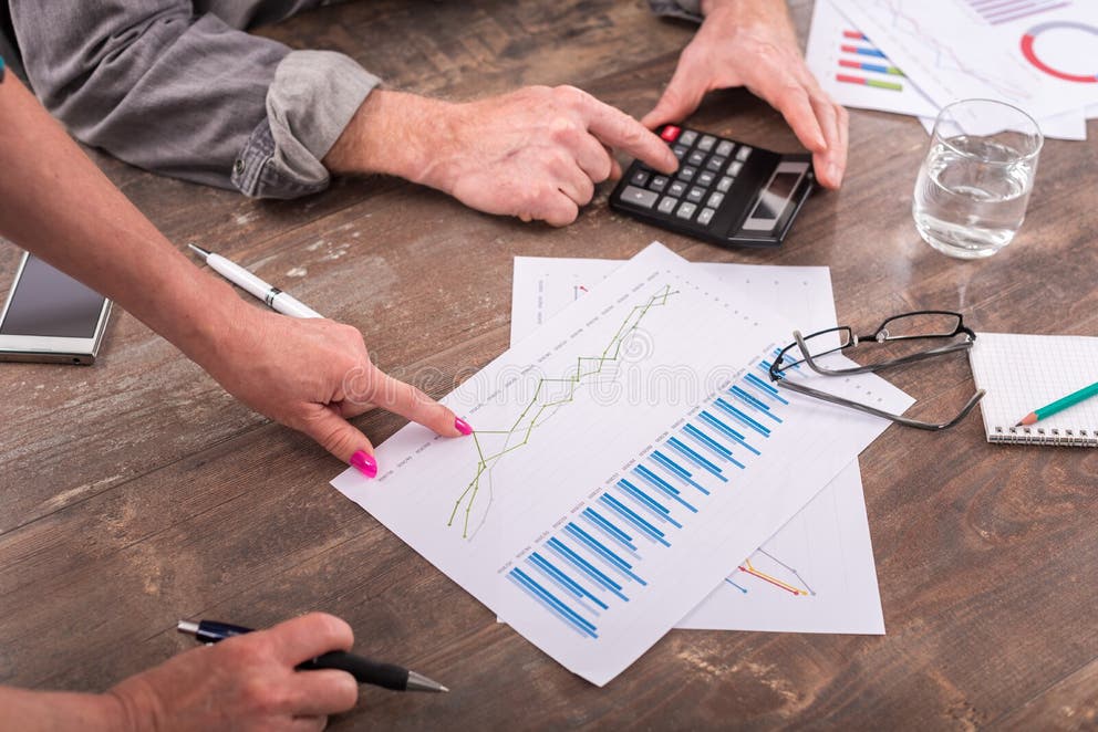 Teamwork and discussion stock image. Image of desk, graph - 61720221