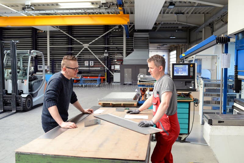 Teamwork Discussion of Workers in the Metal Industry Stock Image ...