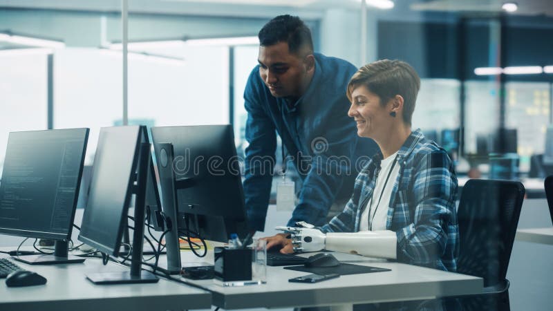 An Inclusive Office Scene with a Diverse Team Working Together. Focus ...