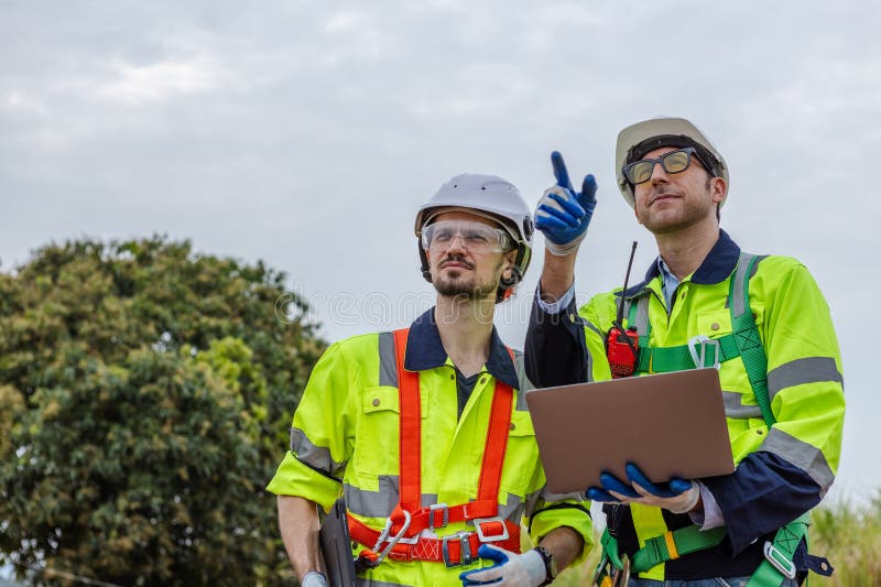 Teamwork Engineer Worker Wearing Safety Uniform Using Laptop at Wind ...
