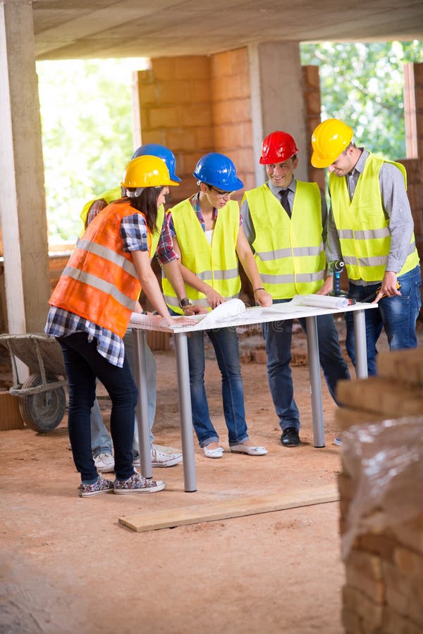 Teamwork of Engineers at Construction Site Stock Photo - Image of ...