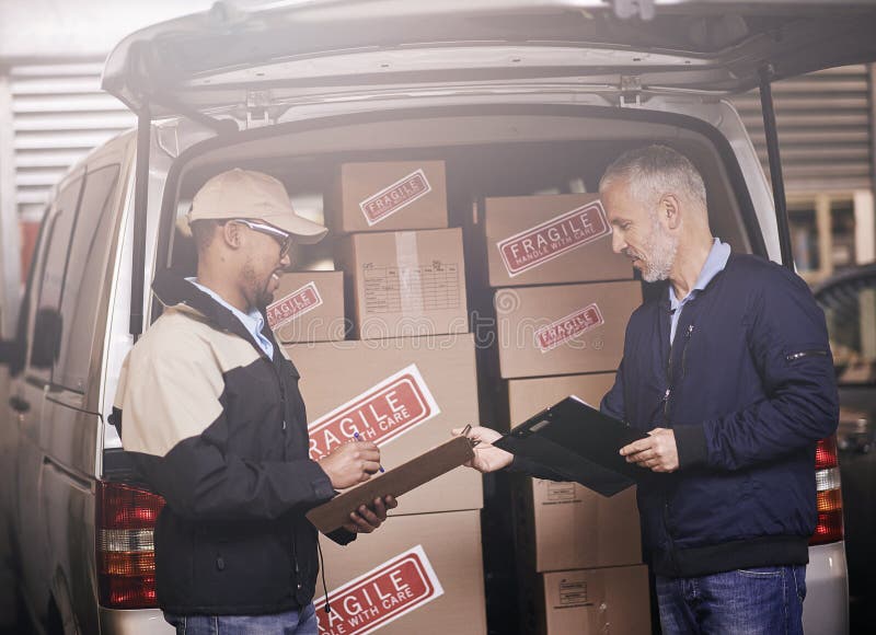 Teamwork Ensures a Timely Delivery. Two Delivery Men Having a ...