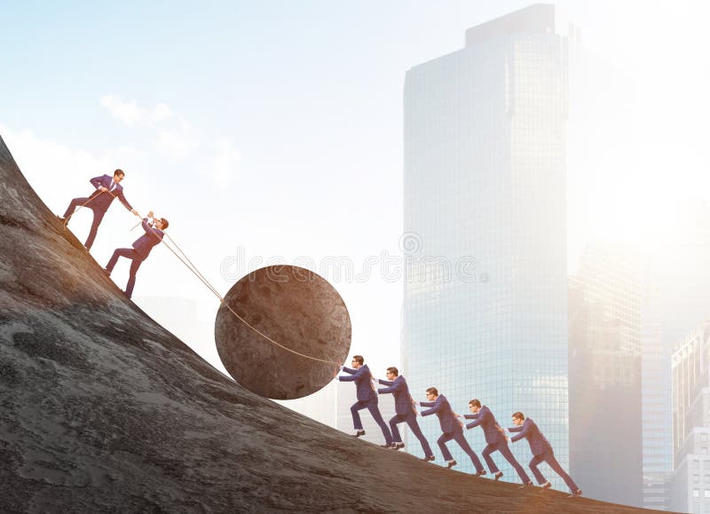 Teamwork Example with Business People Pushing Stone To Top Stock Photo ...