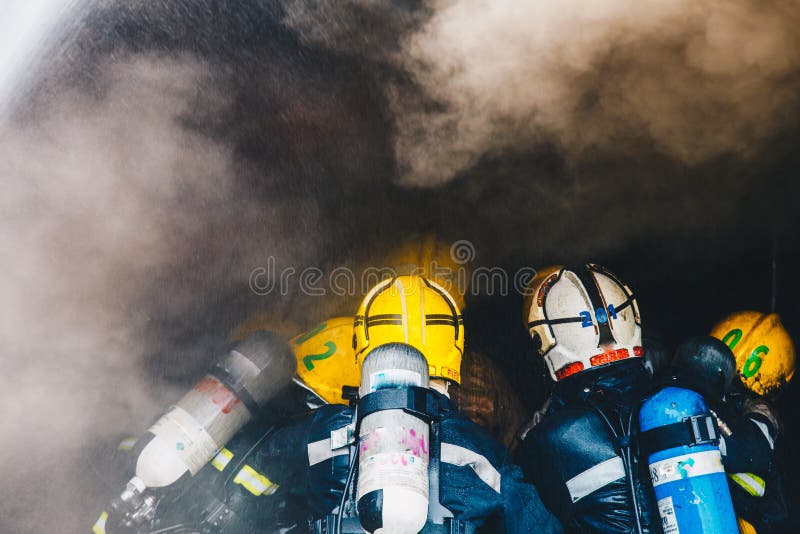 Teamwork of Firefighters Training Stock Image - Image of building, gear ...
