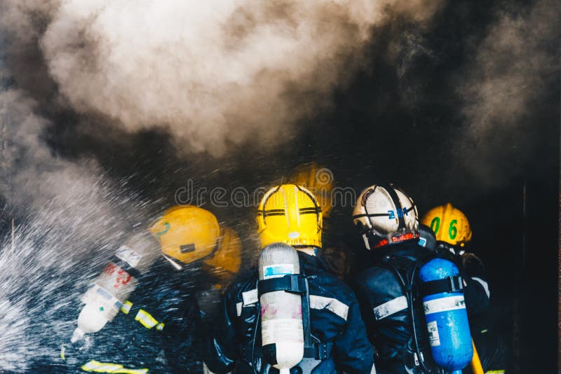 Teamwork of Firefighters Training Stock Photo - Image of fireman ...