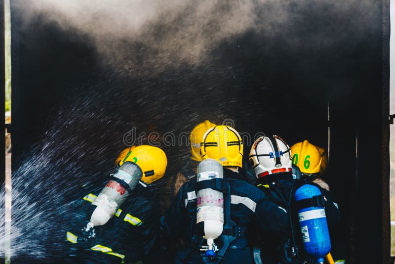 Teamwork of Firefighters Training Stock Image - Image of afraid ...