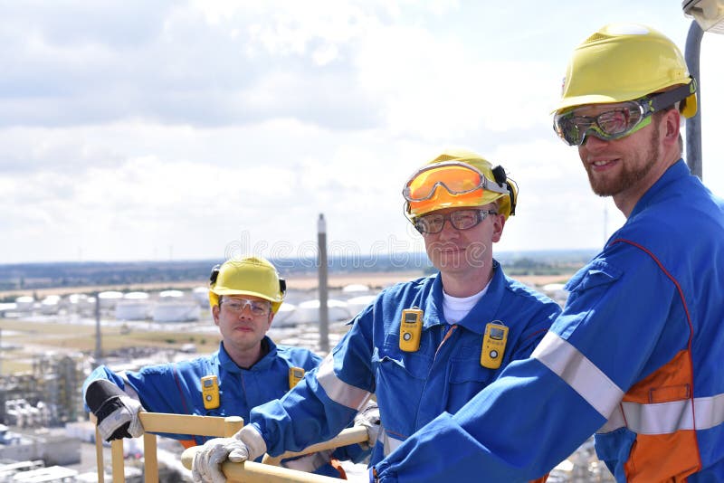 Chemical Industry Plant - Workers in Work Clothes in a Refinery with ...