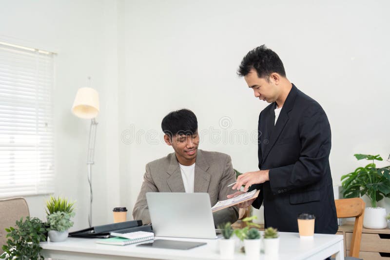 Teamwork and Idea Sharing. Two Colleagues Exchanging Thoughts and ...