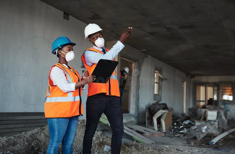 Teamwork Keeps a Construction Project on Track. a Young Man and Woman ...