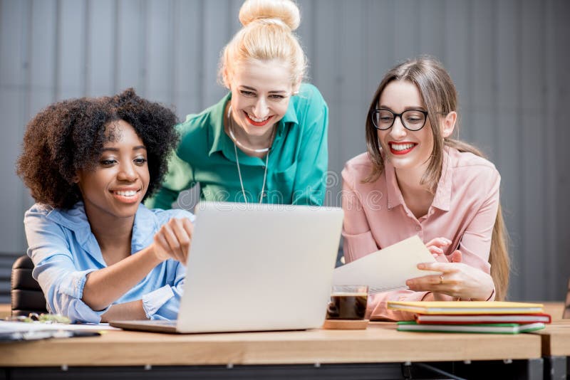 Teamwork with laptop stock image. Image of teamwork, shirts - 92235305